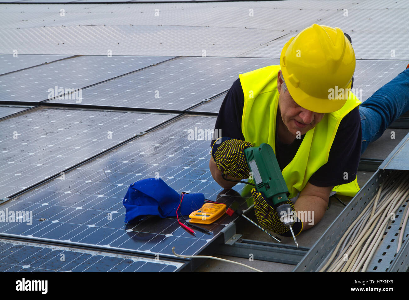 skilled worker working on a photovoltaic plant Stock Photo - Alamy
