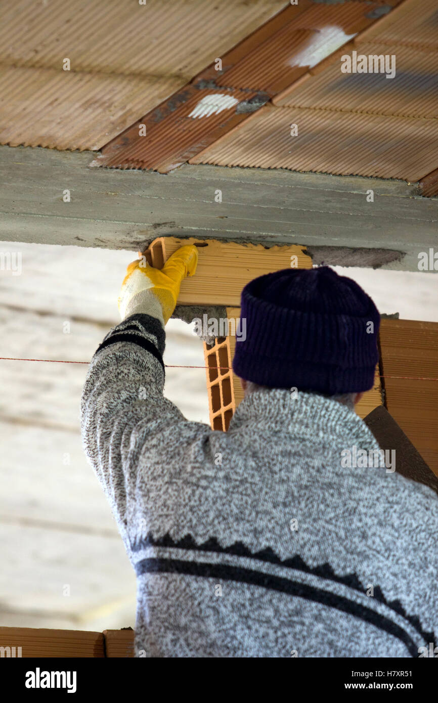 bricklayer at work in a site Stock Photo - Alamy