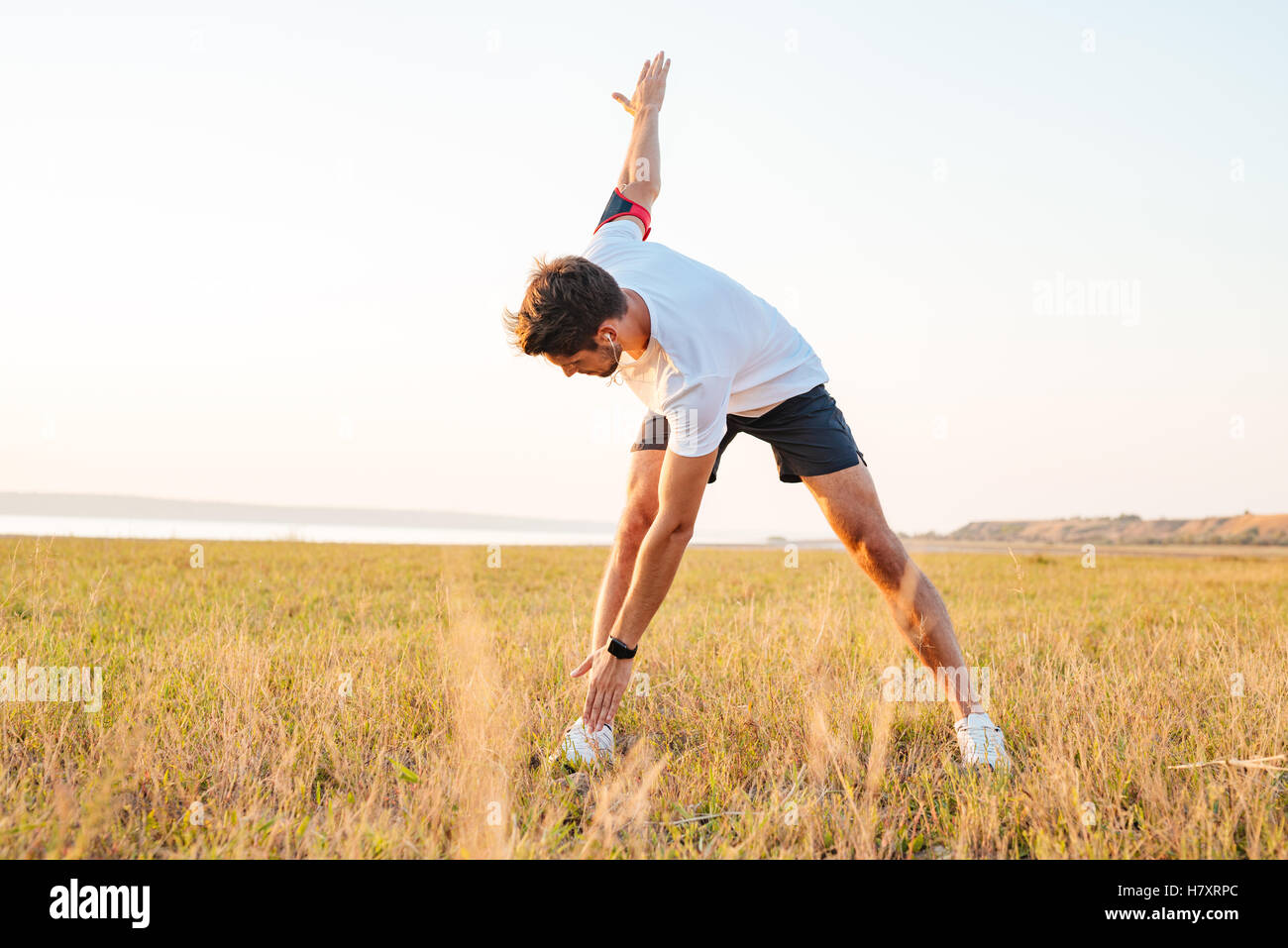 Man stretching in the morning hi-res stock photography and images - Alamy