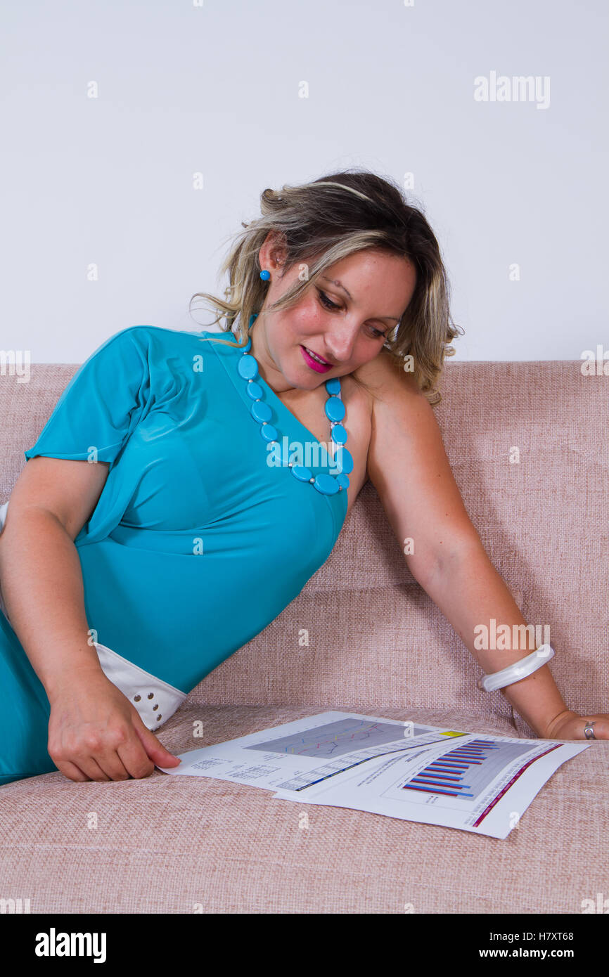woman reading charts and reports Stock Photo - Alamy
