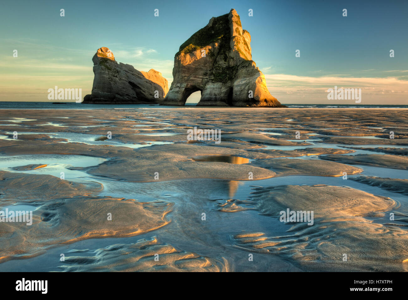 Archway Islands at sunrise, Wharariki Beach near Collingwood, Golden Bay, New Zealand Stock ...