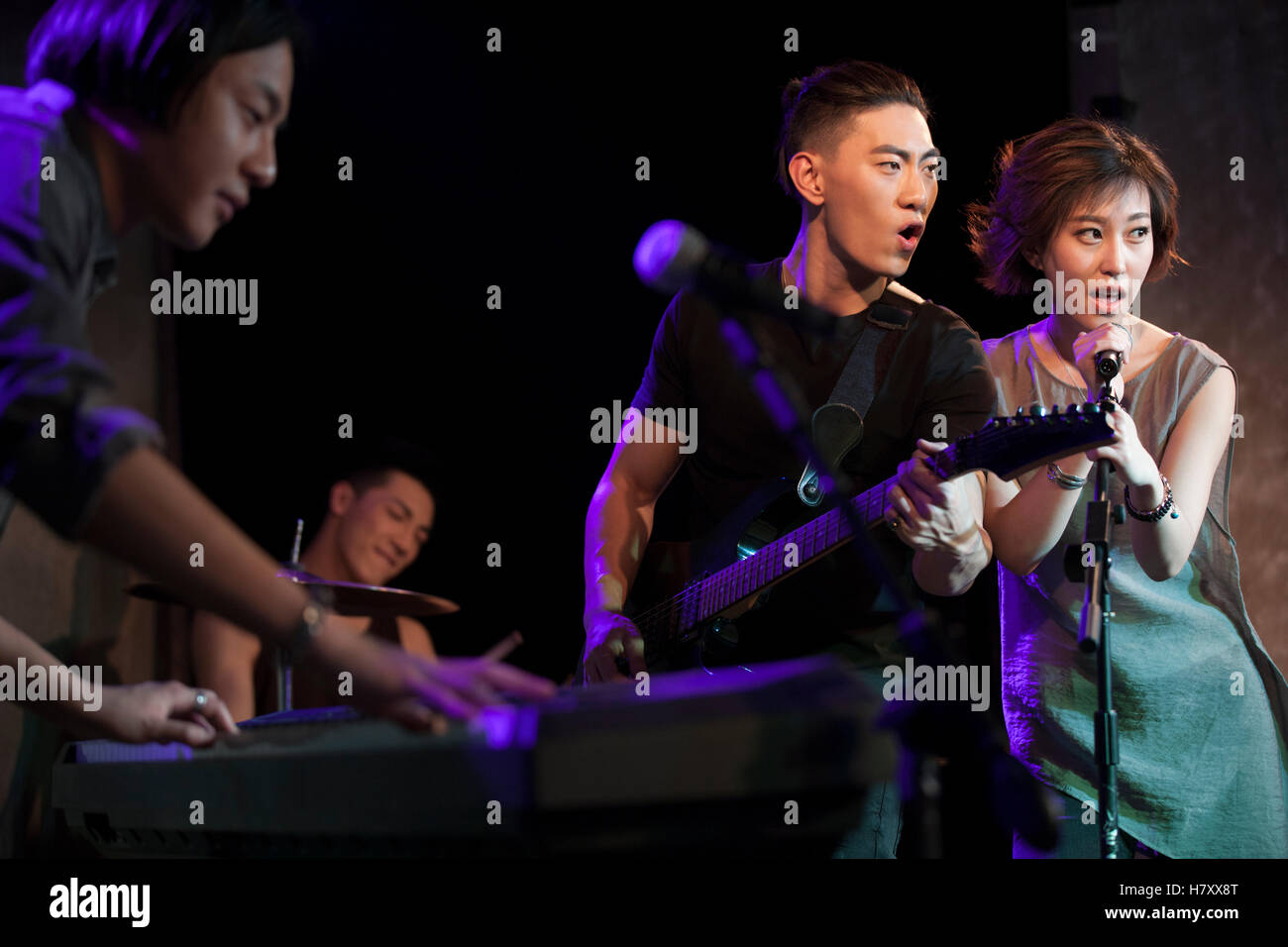 Chinese musical band performing on stage Stock Photo - Alamy