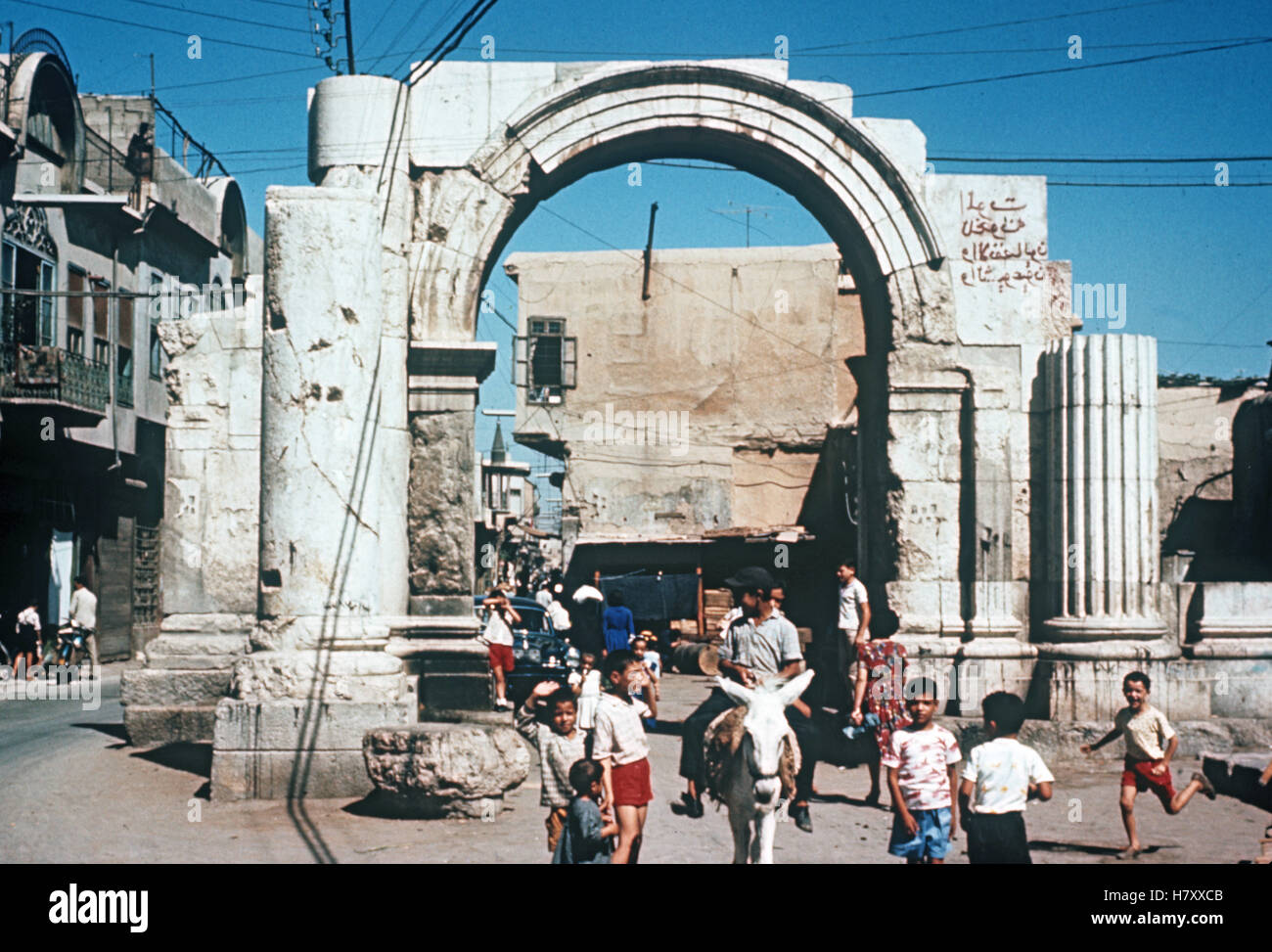Street scene at roman arch in the "Damascus Straight Street" in the old ...