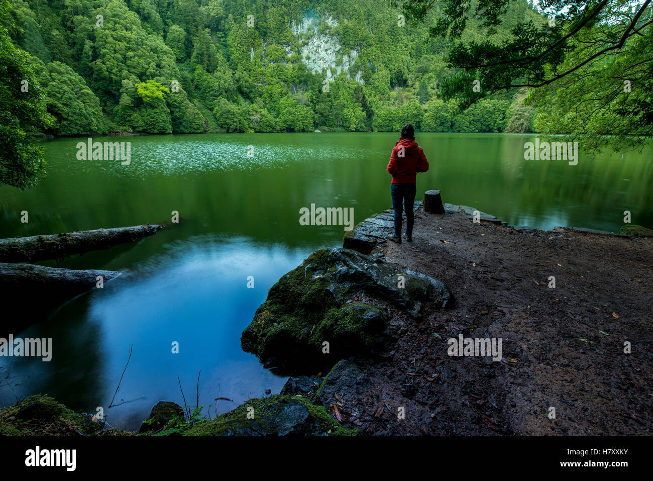 Young woman enjoying the calm of Lagoa do Congro; Sao Miguel, Azores ...