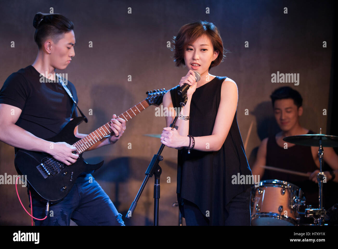 Chinese musical band performing on stage Stock Photo - Alamy