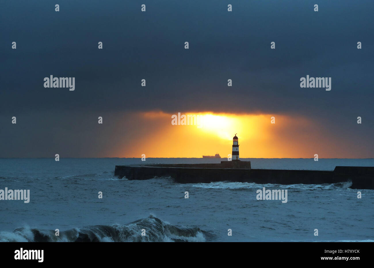 Seaham Lighthouse in Co Durham as a gap in the cloud lets the sun ...