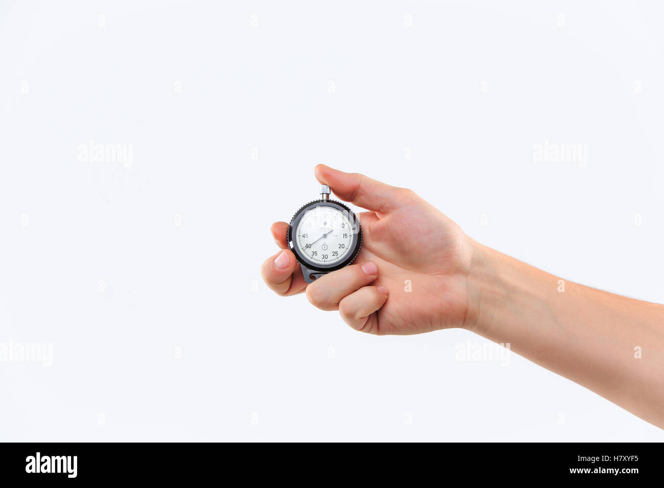 hand holding a stopwatch against white background Stock Photo - Alamy
