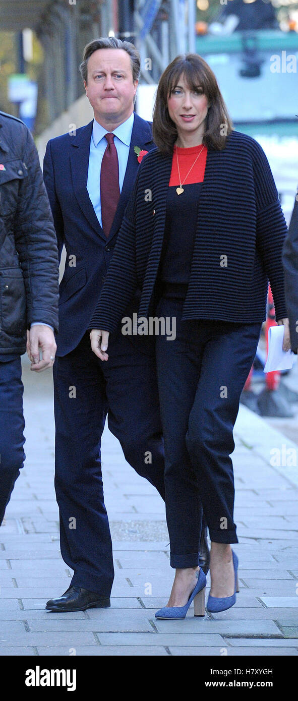 Former prime minister David Cameron (centre) accompanied by his wife ...
