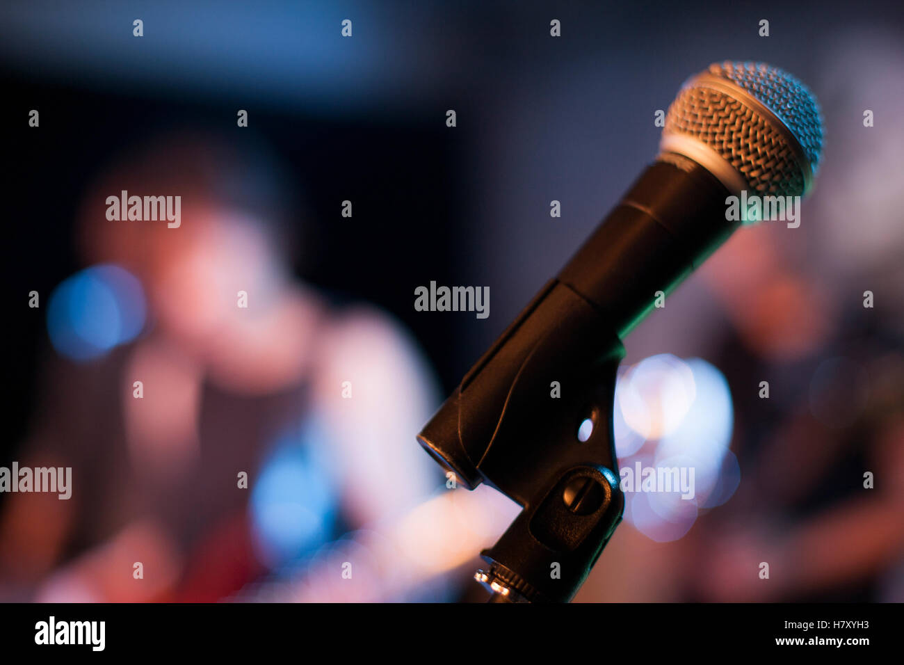 Microphone on stage Stock Photo - Alamy