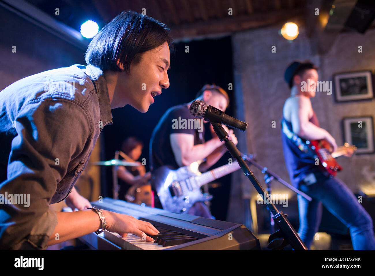 Three asian men performing music hi-res stock photography and images ...