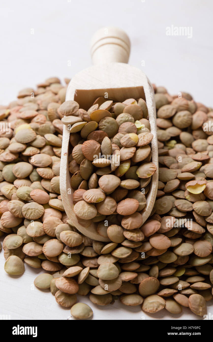 natural organic dry lentils on white table with scoop Stock Photo - Alamy