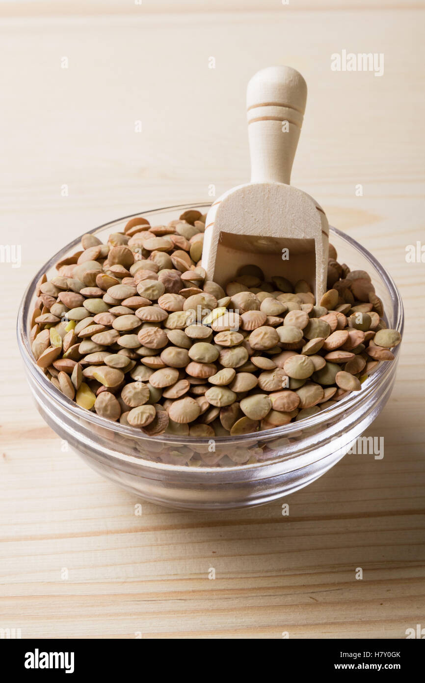 natural organic dry lentils in glass bowl with scoop Stock Photo - Alamy