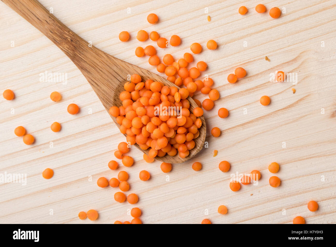 natural organic dry red lentils with spoon Stock Photo - Alamy