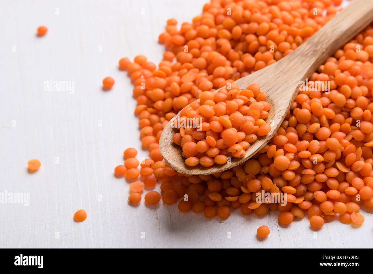 natural organic dry red lentils with spoon Stock Photo - Alamy