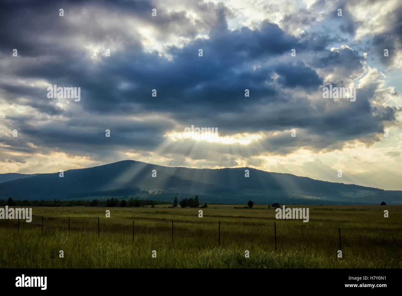 countryside sunset landscape with clouds and sun rays Stock Photo - Alamy