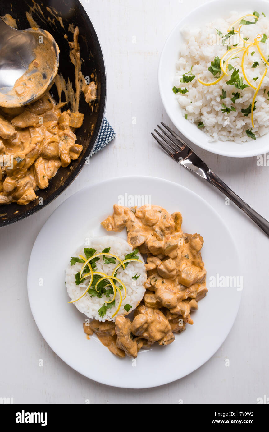 beef stroganoff with rice on white plate Stock Photo - Alamy