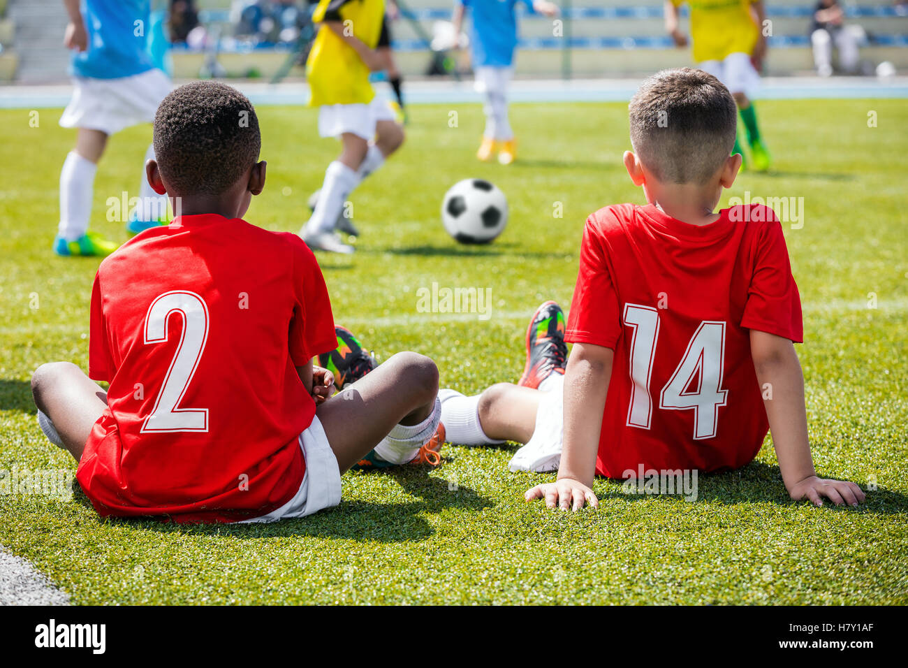 Children football soccer tournament. Kids playing football match. Two ...
