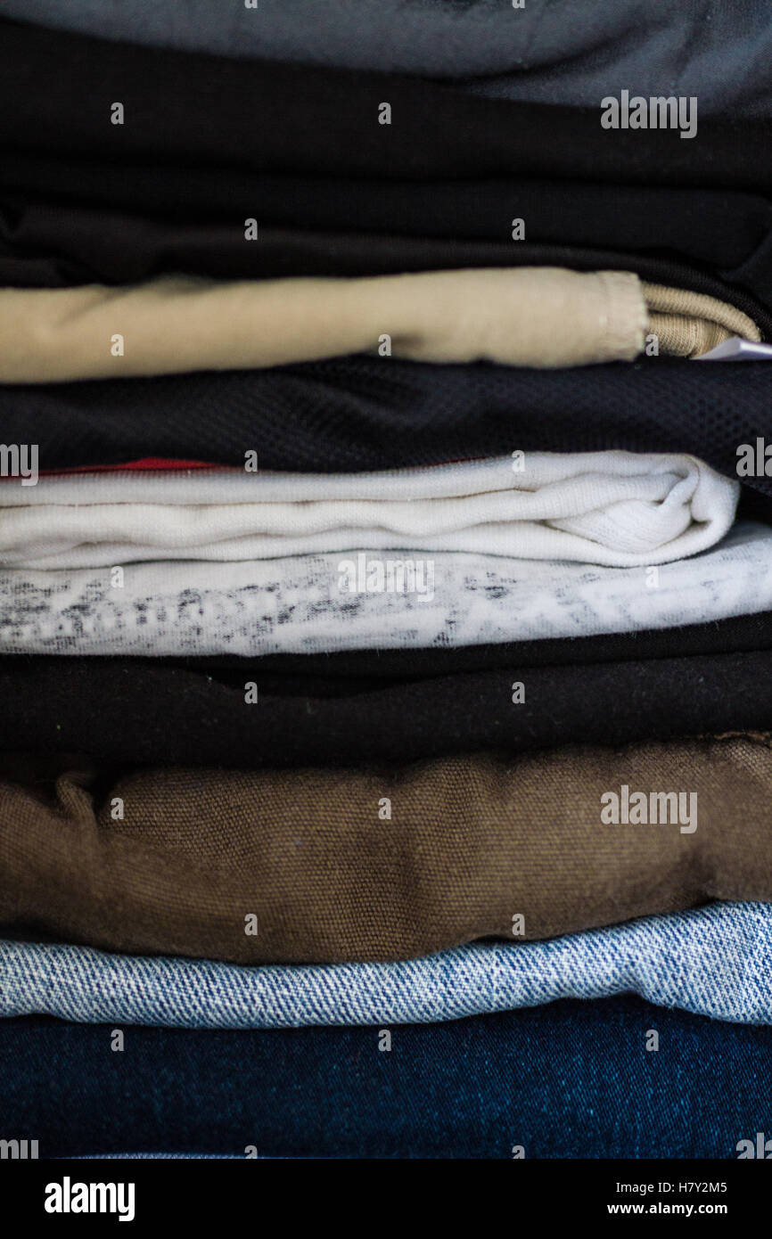 A pile of colorful clothes on white Stock Photo - Alamy