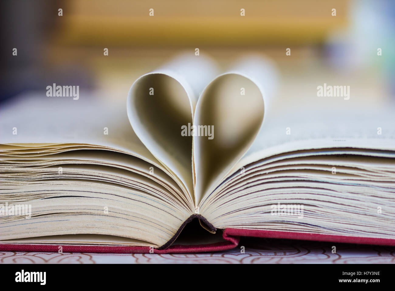 Opened book with heart shaped pages Stock Photo - Alamy