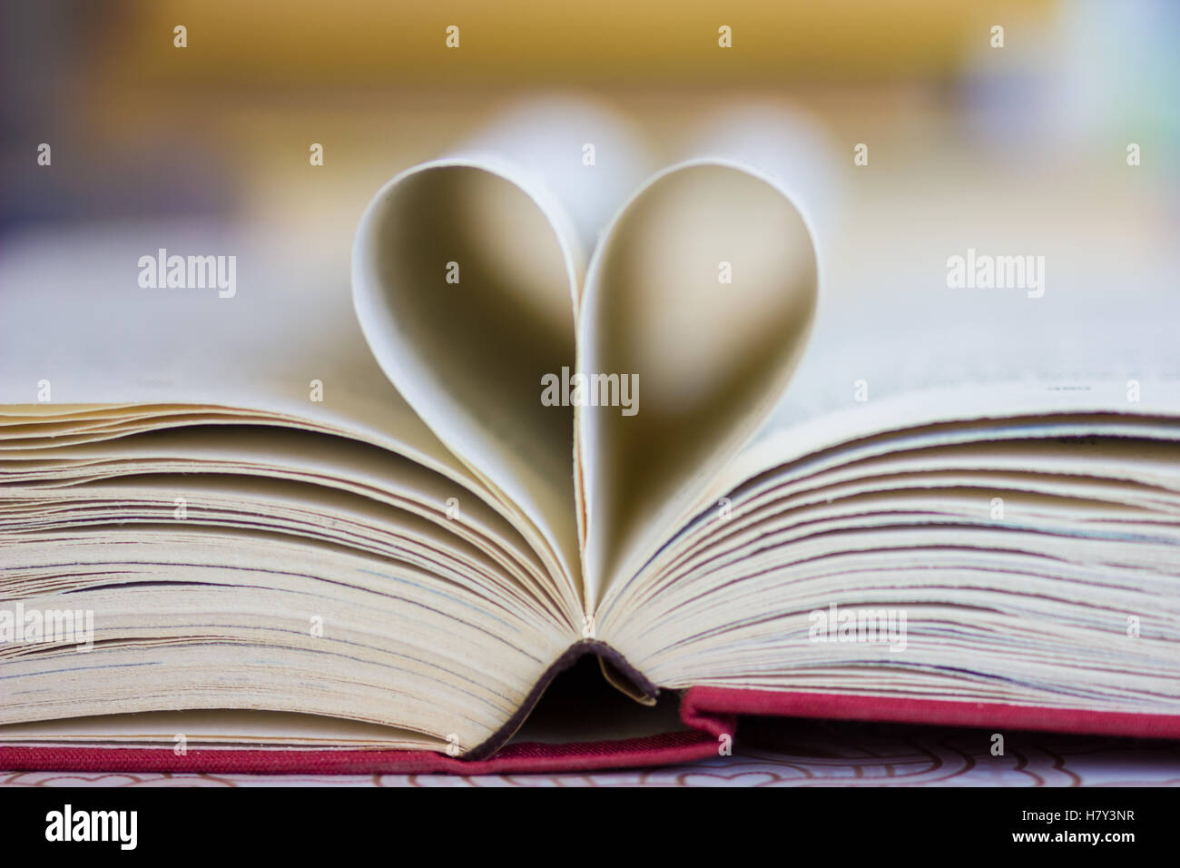 Opened book with heart shaped pages Stock Photo - Alamy