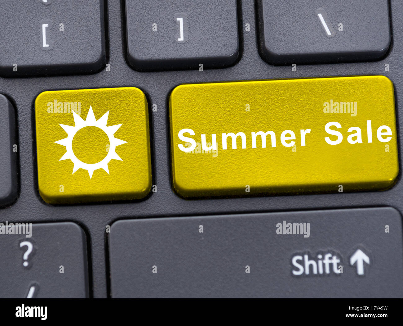 Computer keyboard in close-up with summer sale text and sun symbol ...