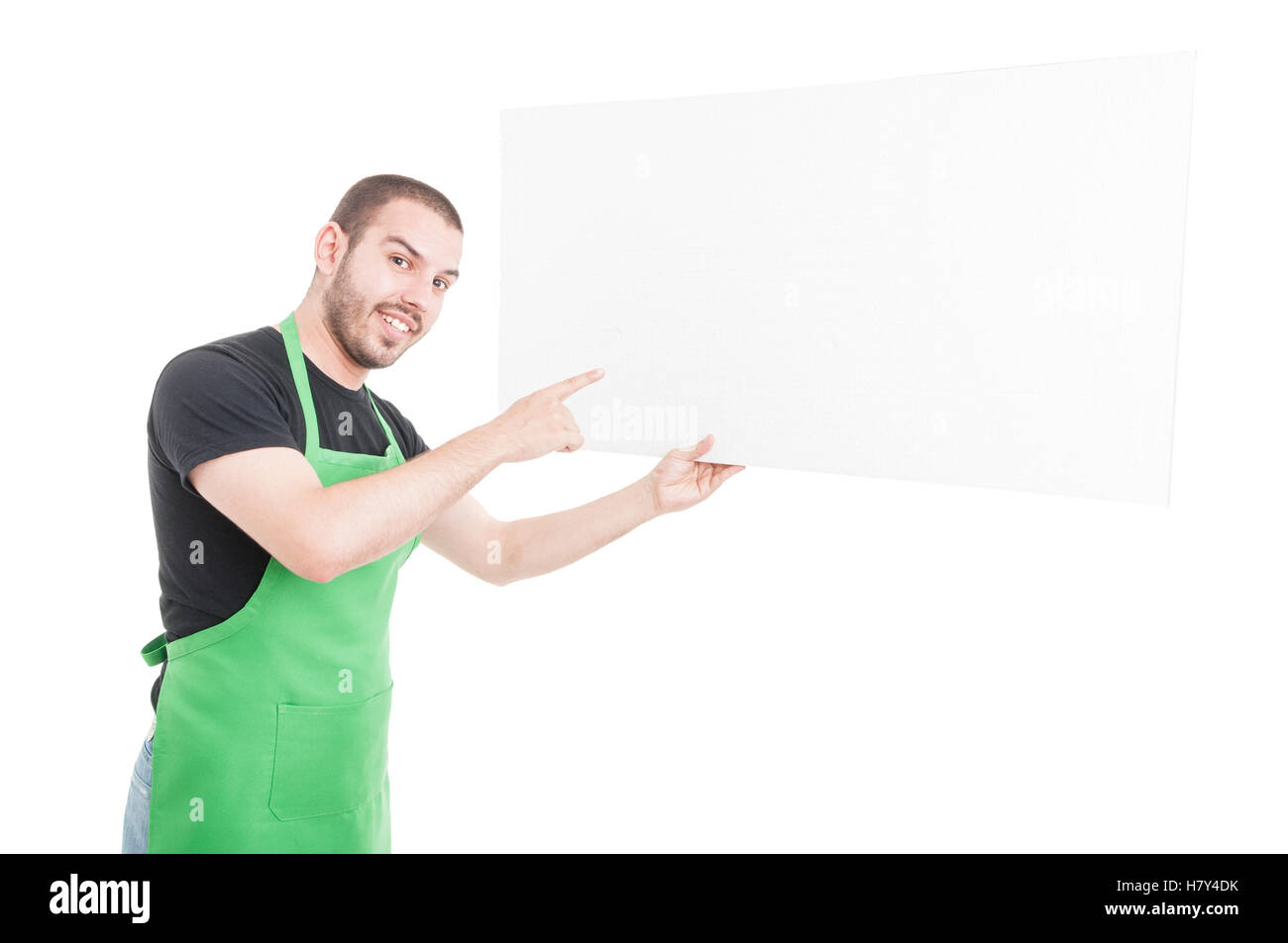 Male employee pointing and holding big advertising board isolated on ...