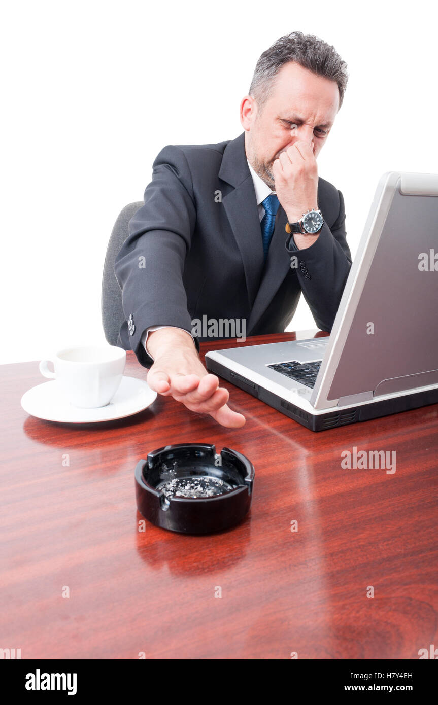 Man at office covering nose from bad smoke smell isolated on white ...