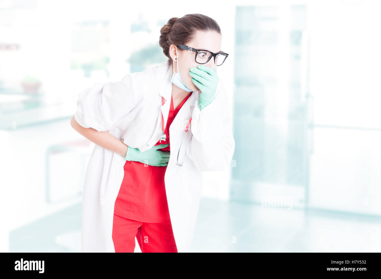 Sick doctor having indigestion or belly pain and vomiting as ...