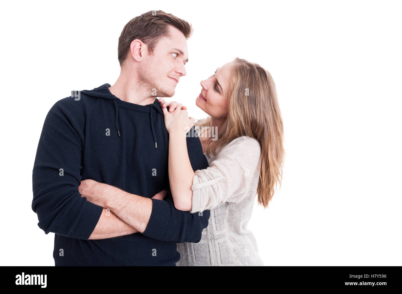 Happy couple posing and being affective with each other isolated on ...