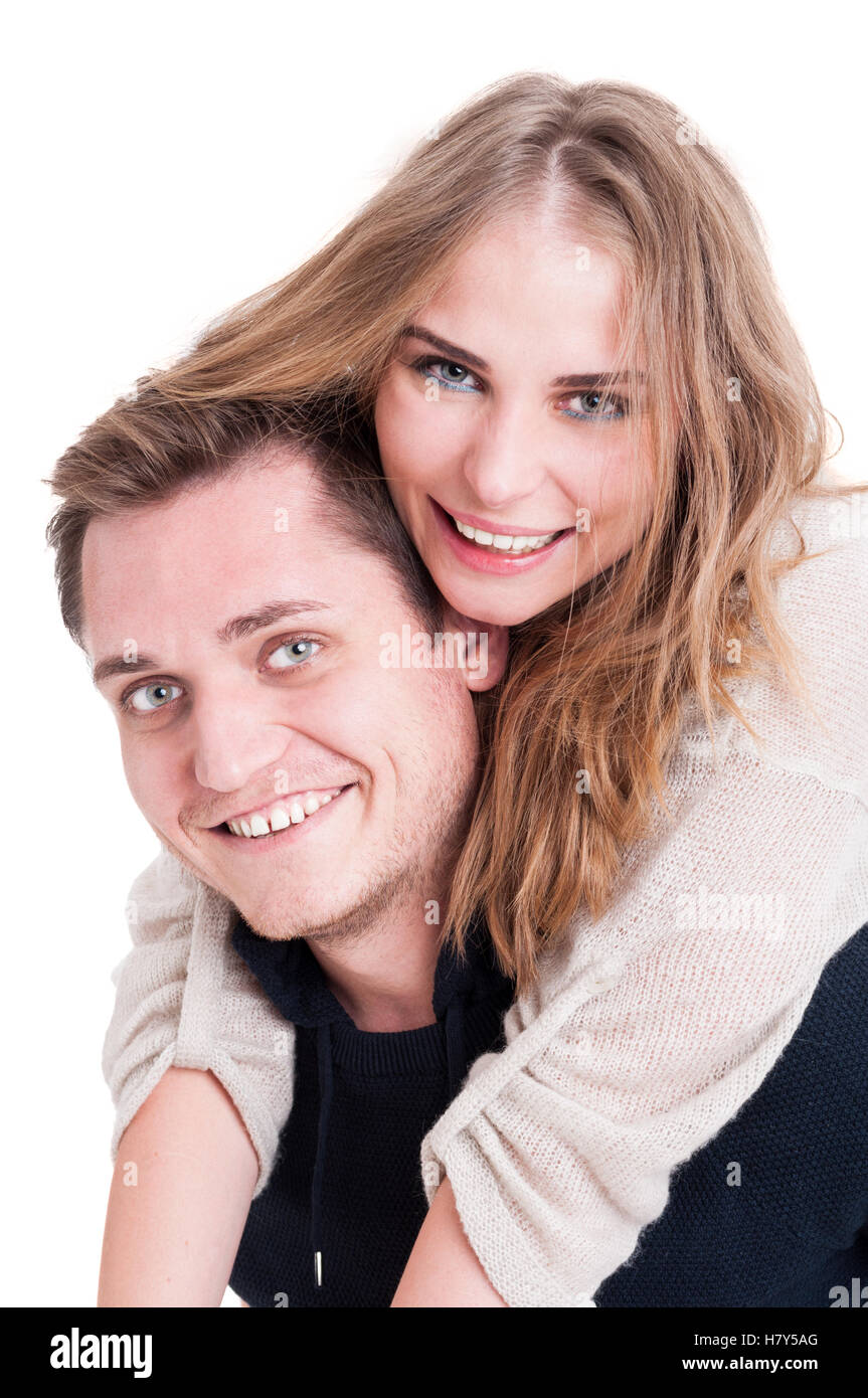 Happy couple portrait cuddling and being joyful and playful isolated on ...