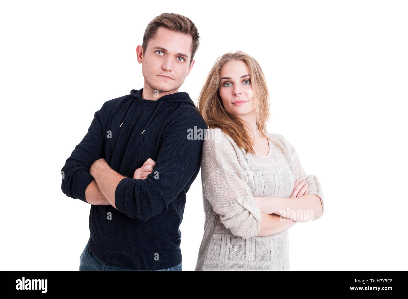 Couple posing and standing with arms crossed back to back looking like ...