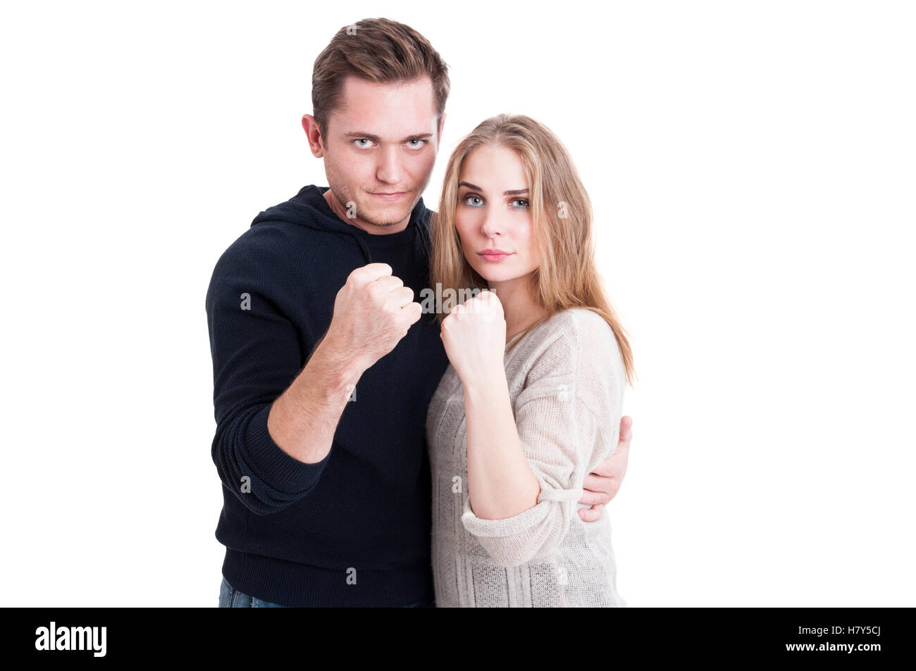 Attractive couple showing fist like for a fight isolated on white ...