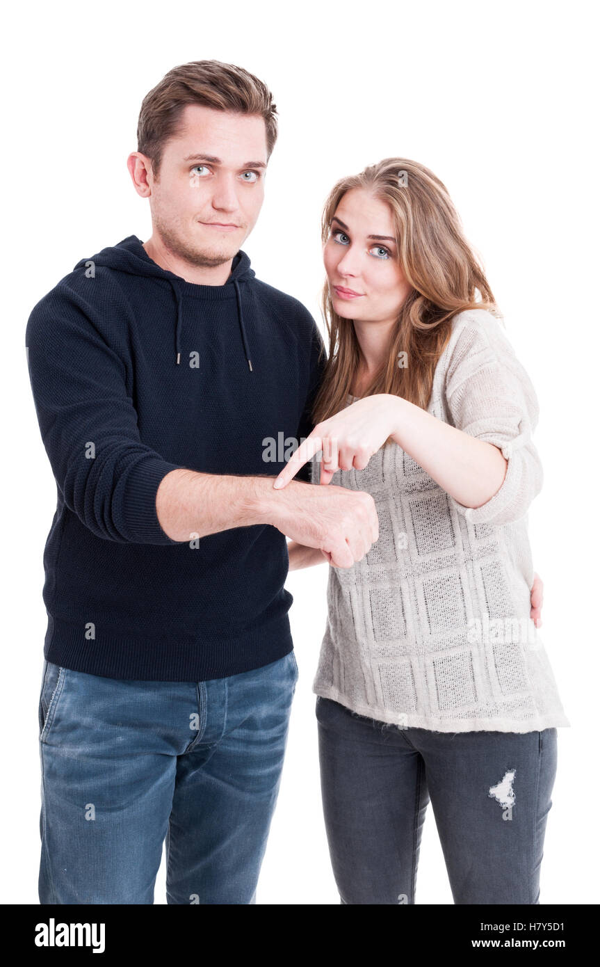 Couple posing and showing wrist watch like time out or being late ...