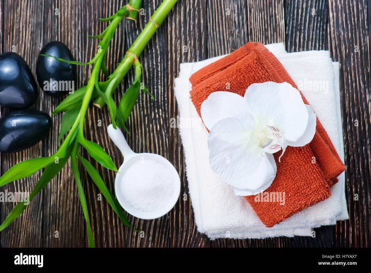 clear towels, black stones and bamboo on a table Stock Photo - Alamy