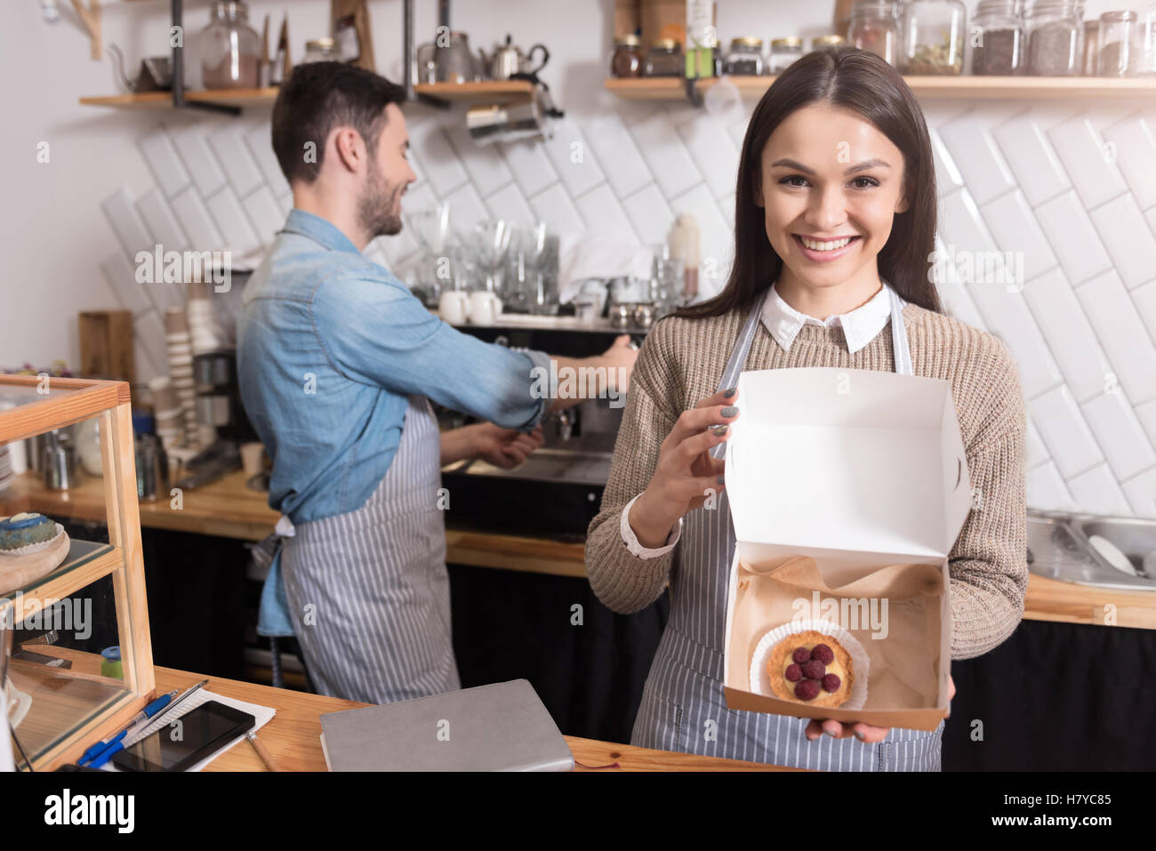 Delighted positive waiters preparing order Stock Photo - Alamy