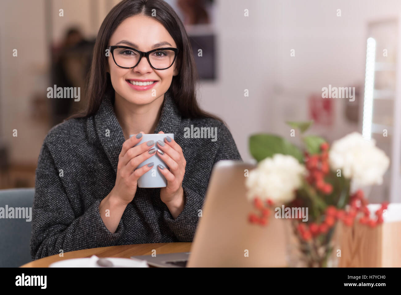 : Delighted beautiful woman relaxing in a cafe Stock Photo - Alamy