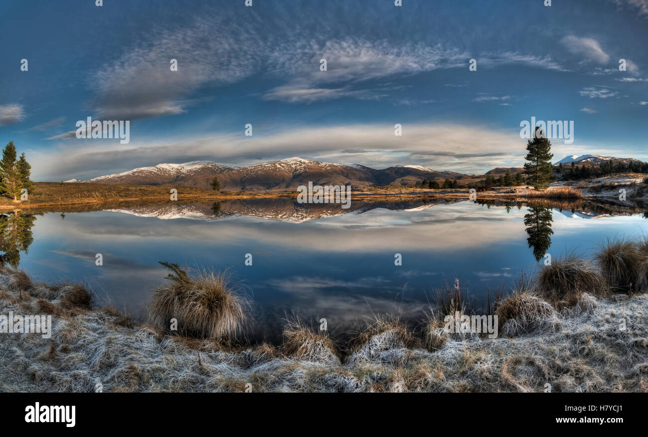 Frosty winter dawn with reflection in small pond, central Otago, New ...