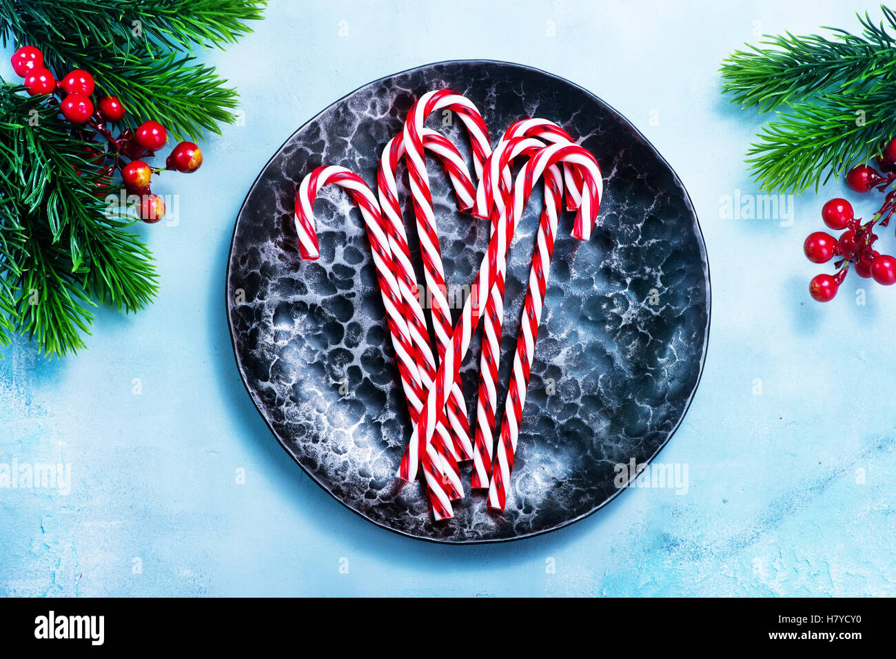 candycanes on plate and on a table Stock Photo - Alamy