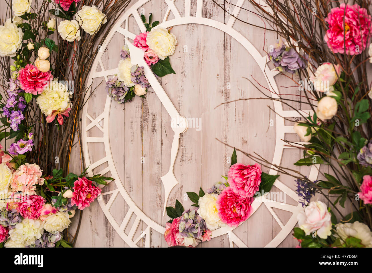 Spring decoration with a big clock in the interior Stock Photo - Alamy