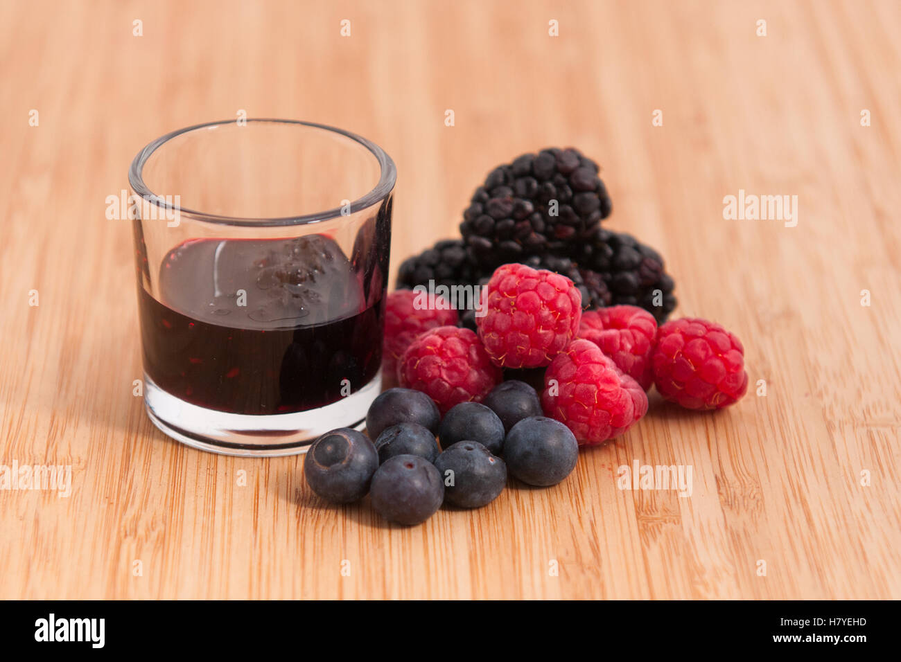 Natural flavored liquid for pastry of red fruits Stock Photo - Alamy