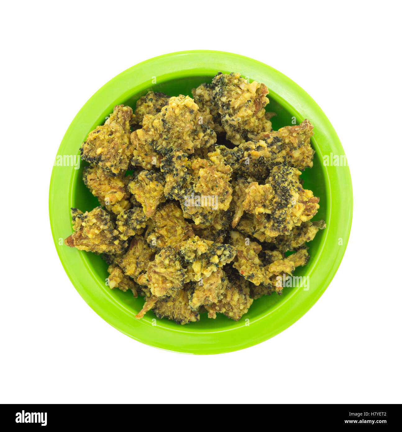 Top view of a small green bowl filled with broccoli crunchies isolated ...