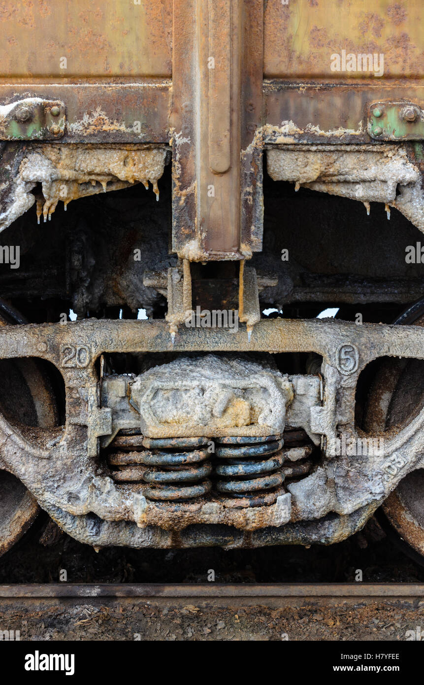 Train rusty wheels covered by salt of Baskunchak lake, Russia. It is ...