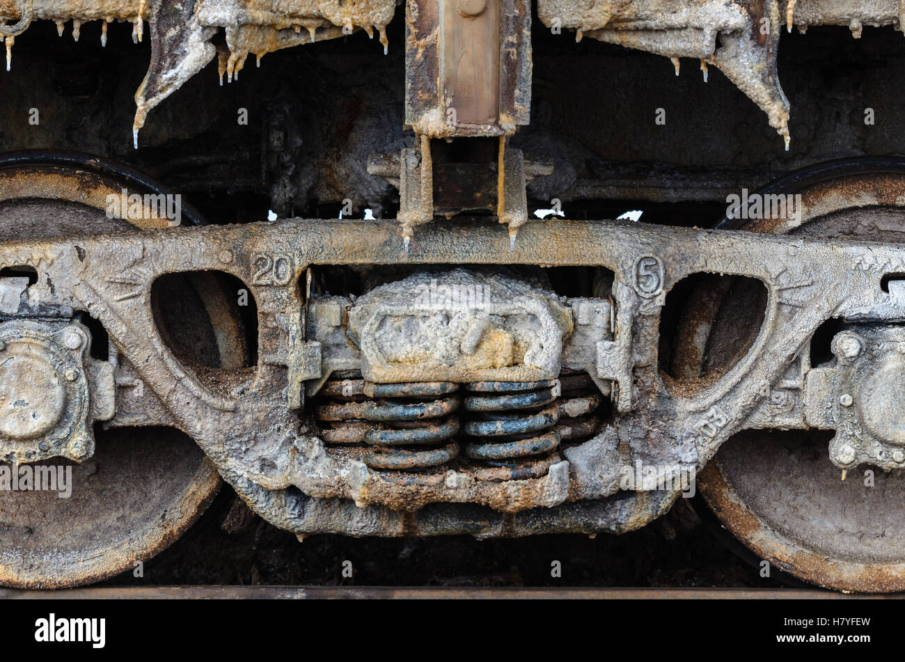 Train rusty wheels covered by salt of Baskunchak lake, Russia. It is ...