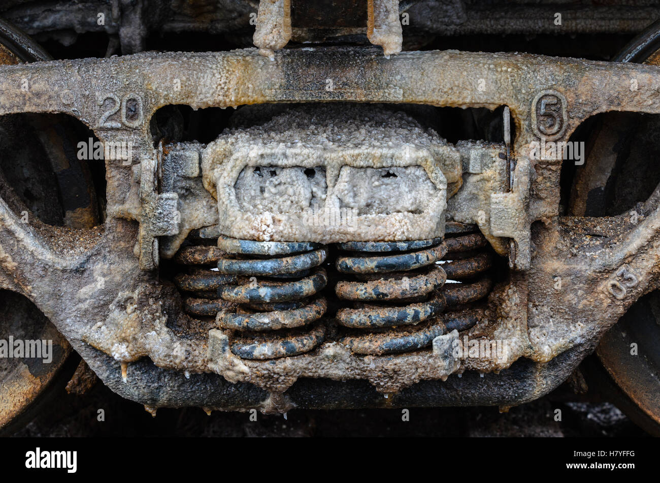 Train rusty wheels covered by salt of Baskunchak lake, Russia. It is ...