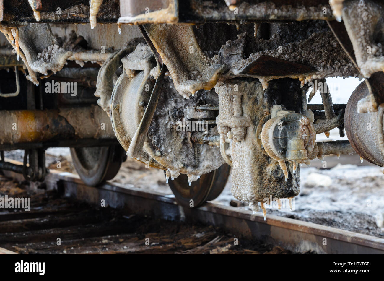 Train rusty wheels covered by salt of Baskunchak lake, Russia. It is ...