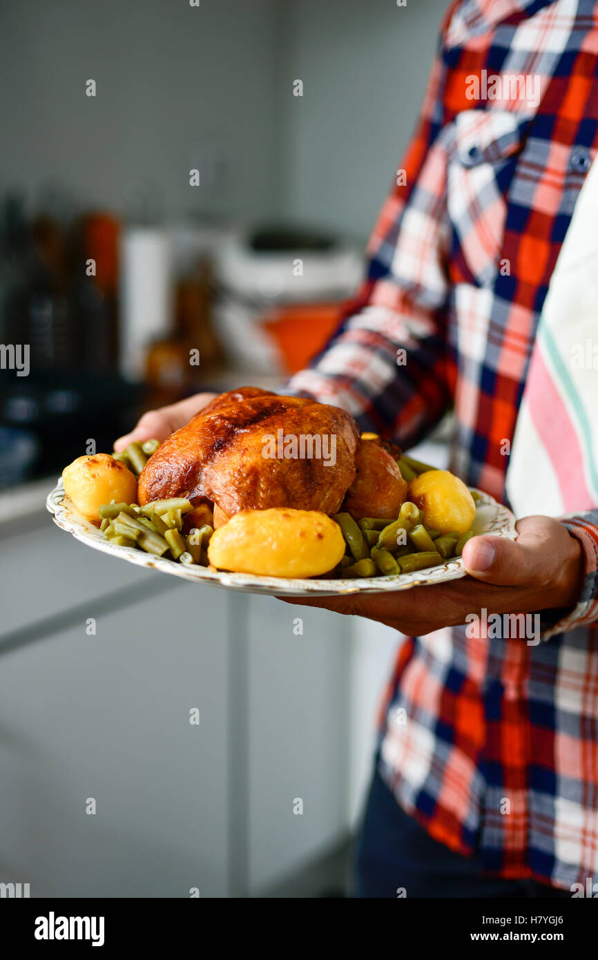Man cooking roast chicken hi-res stock photography and images - Alamy