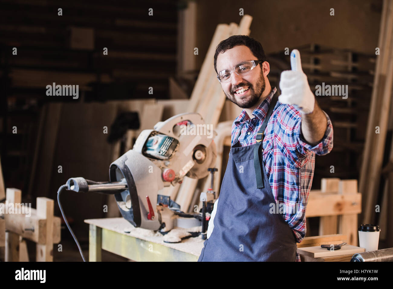 portrait of smiling construction worker thumb up Stock Photo - Alamy