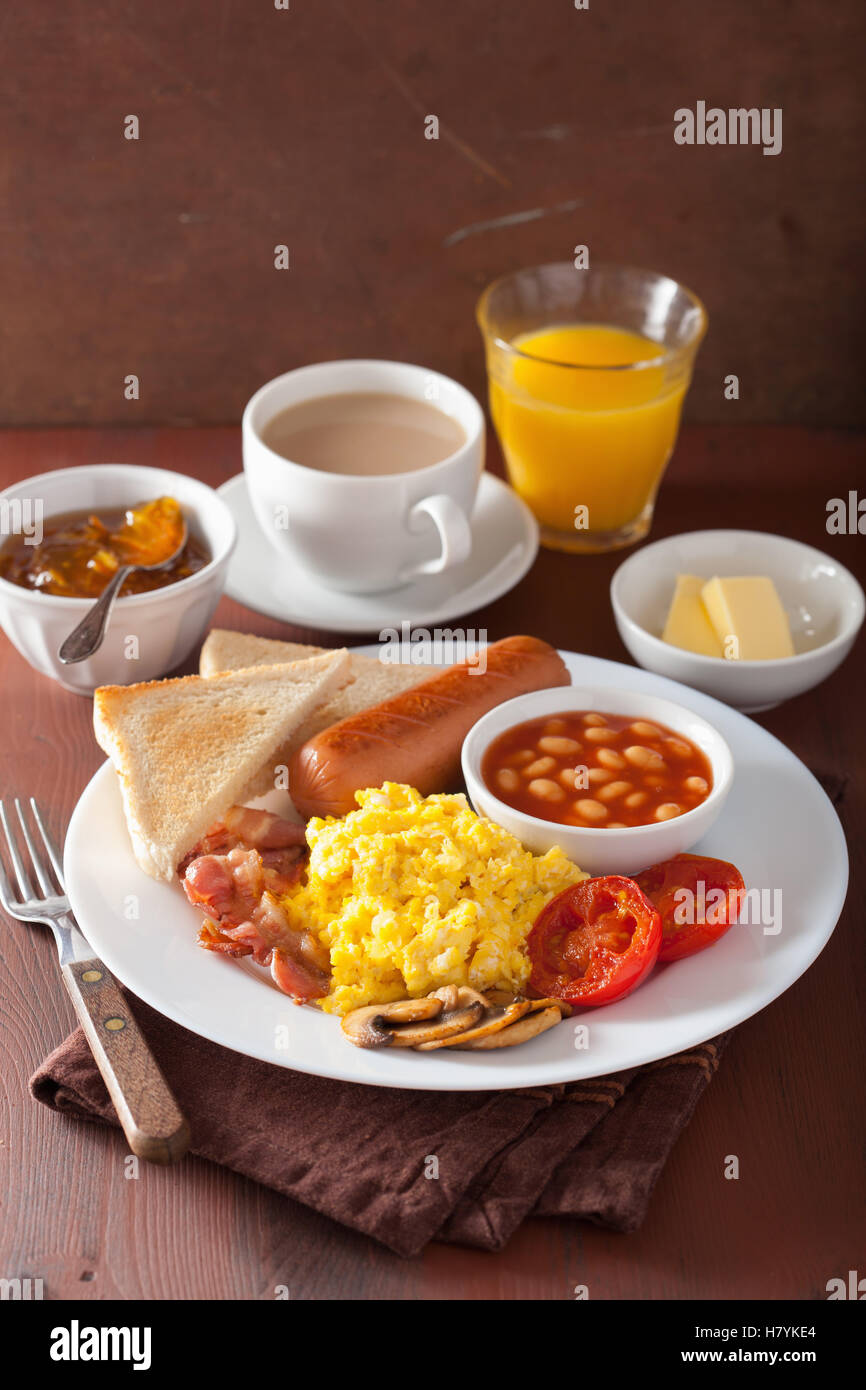 full english breakfast with scrambled eggs, bacon, sausage, beans ...