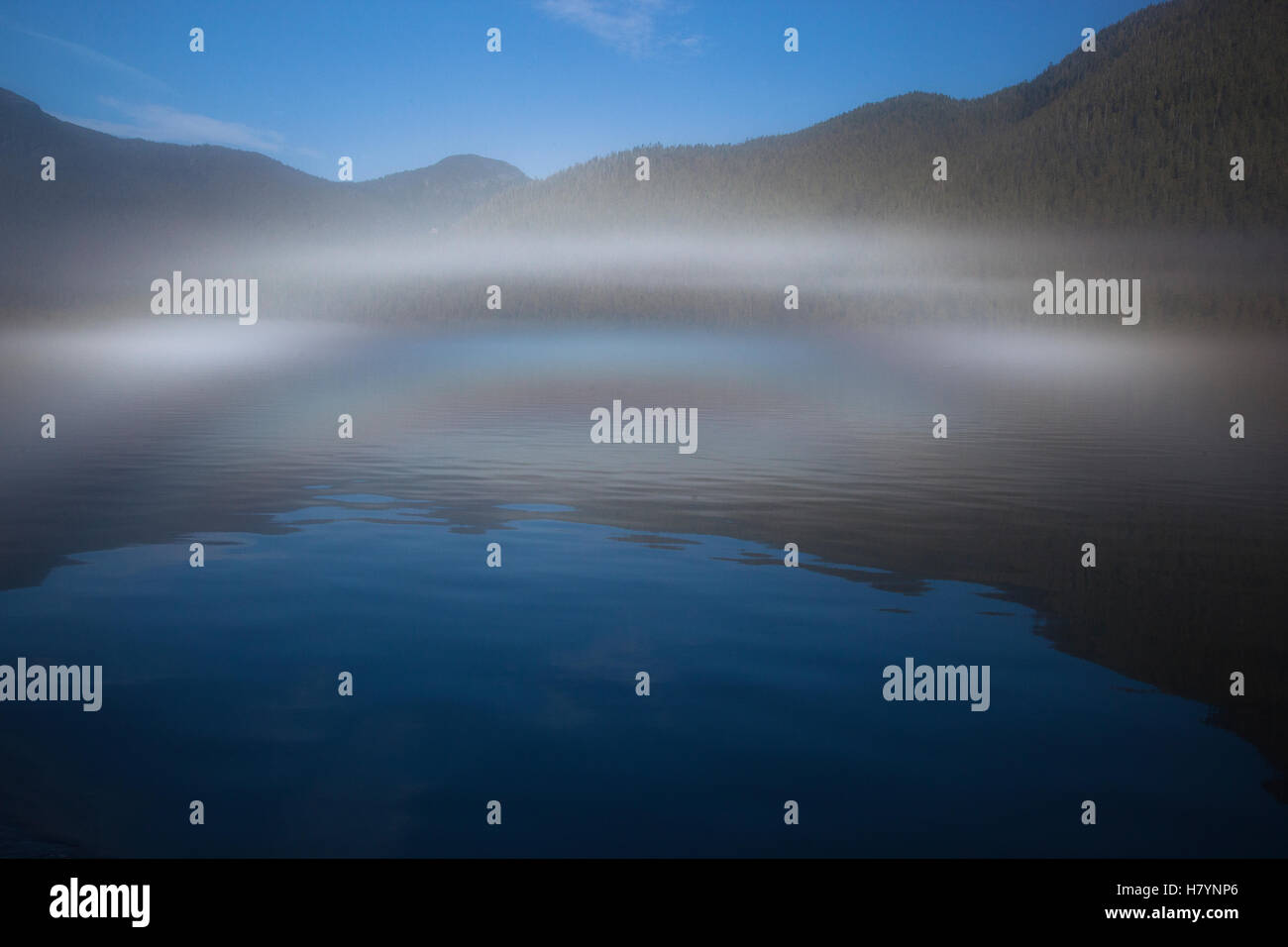 Ocean fog lifting off the water at the mouth of Kynoch Inlet, British ...