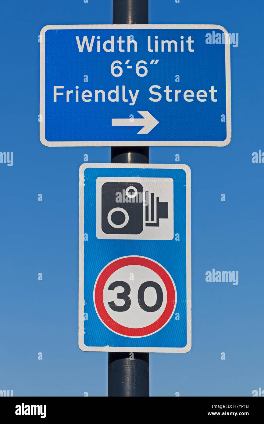 A traffic sign indicating the speed limit with traffic camera logo, and ...